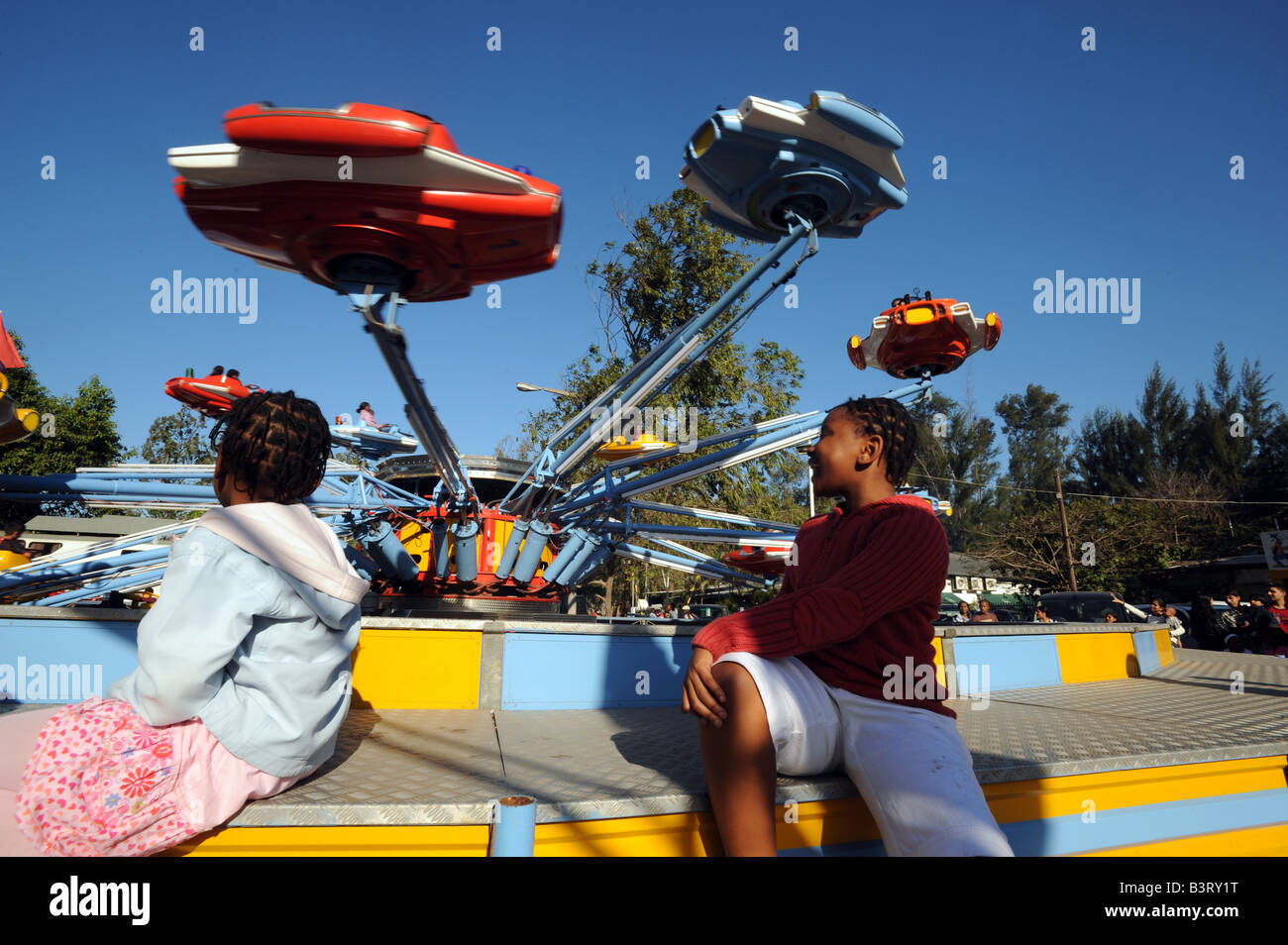 Enjoying rides on the fariground attractions at Feira Popular, Maputo ...