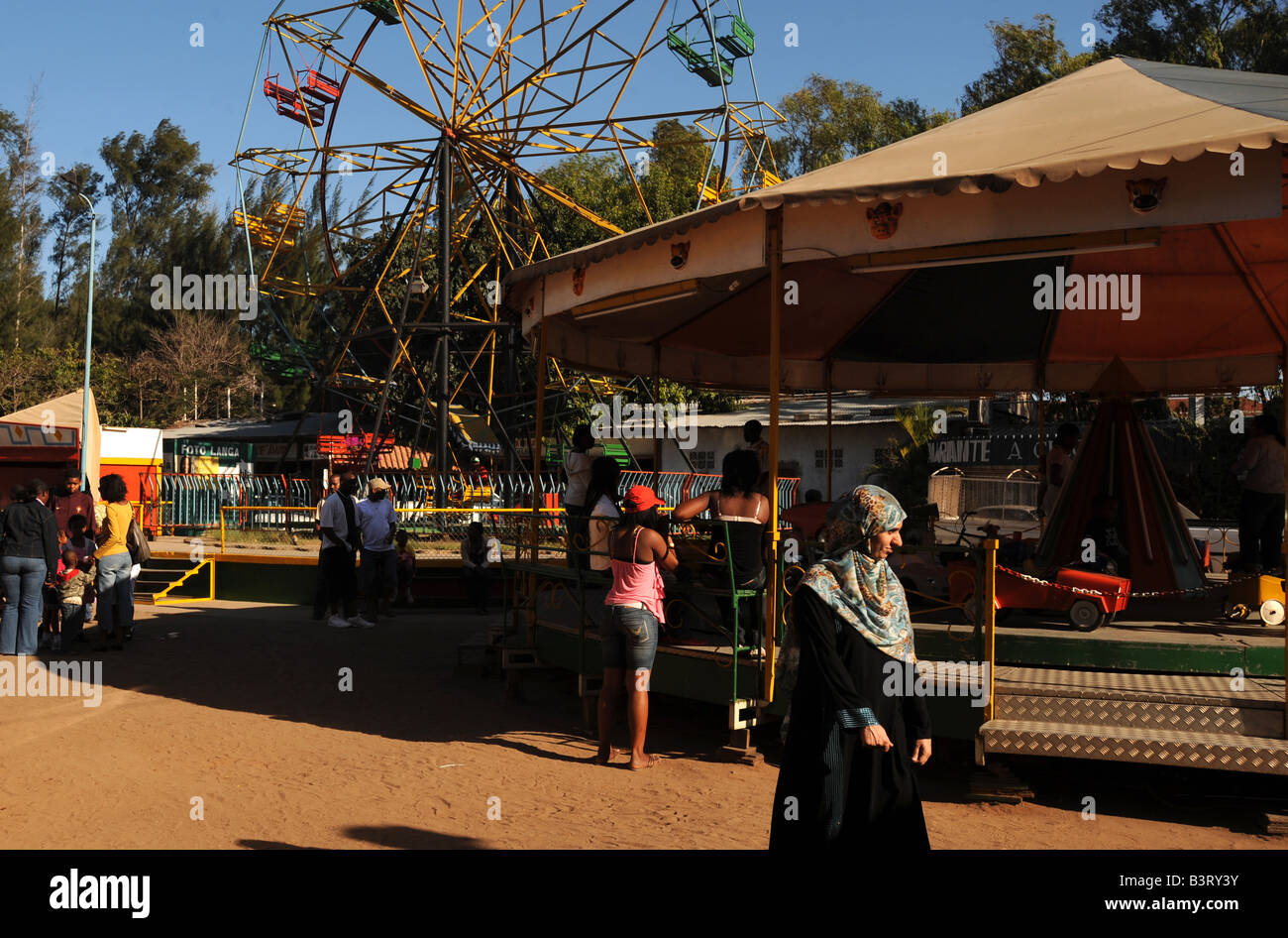 Enjoying rides on the fariground attractions at Feira Popular, Maputo ...
