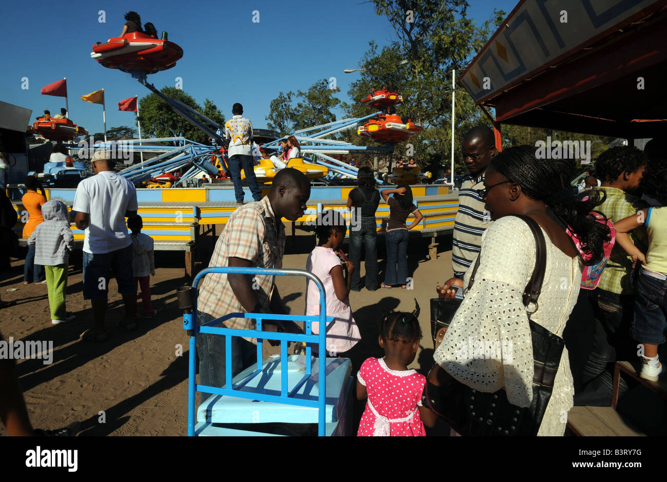 Enjoying rides on the fariground attractions at Feira Popular, Maputo ...