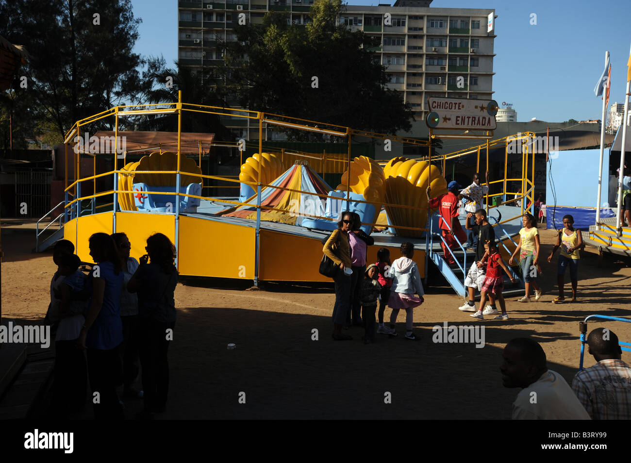 Enjoying rides on the fariground attractions at Feira Popular, Maputo ...