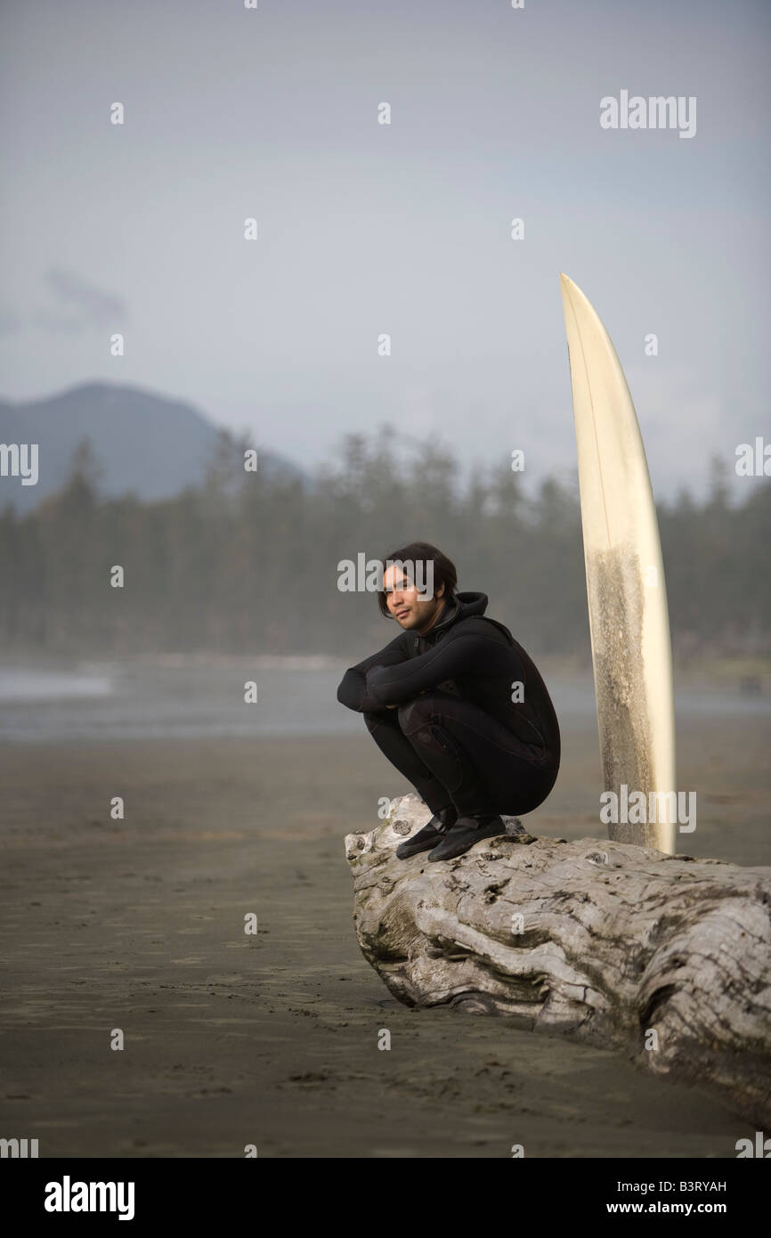 Surfer on beach, Cox Bay near Tofino, British Columbia, Canada Stock ...