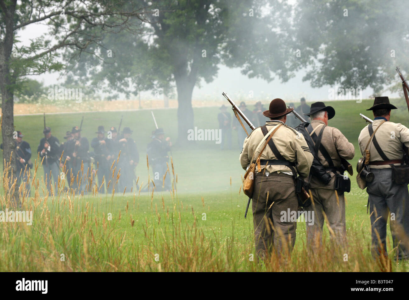 Confederate and Union soldiers face off during a battle at a Civil War ...