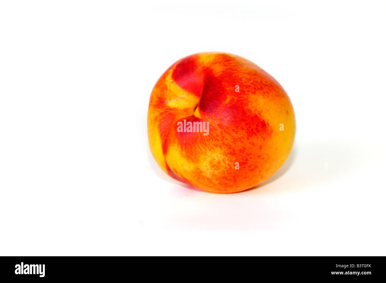 A single whole, ripe nectarine on white background Stock Photo - Alamy