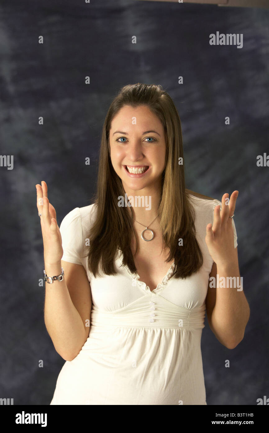 A young woman looking cheerful excited and happy Stock Photo - Alamy