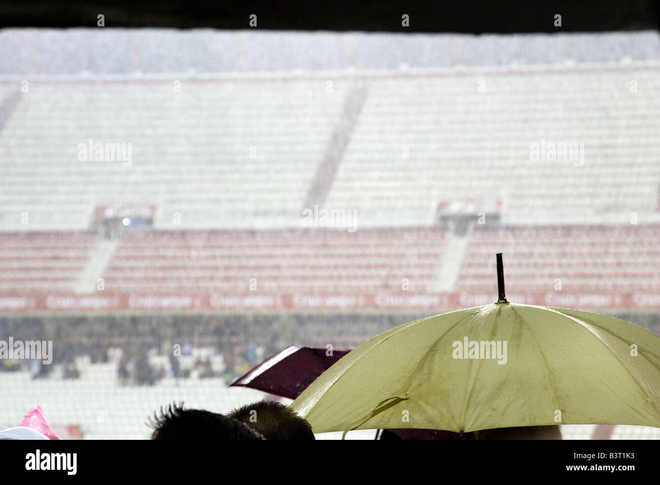 Heavy rain spectators football hi-res stock photography and images - Alamy