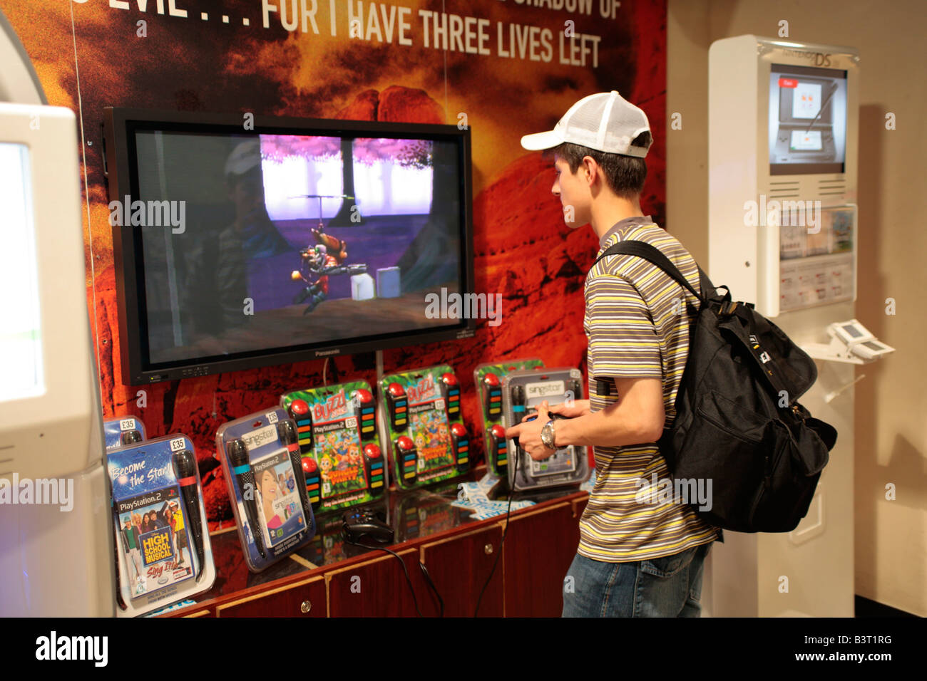 teenage boy in a computer game shop in London Stock Photo - Alamy