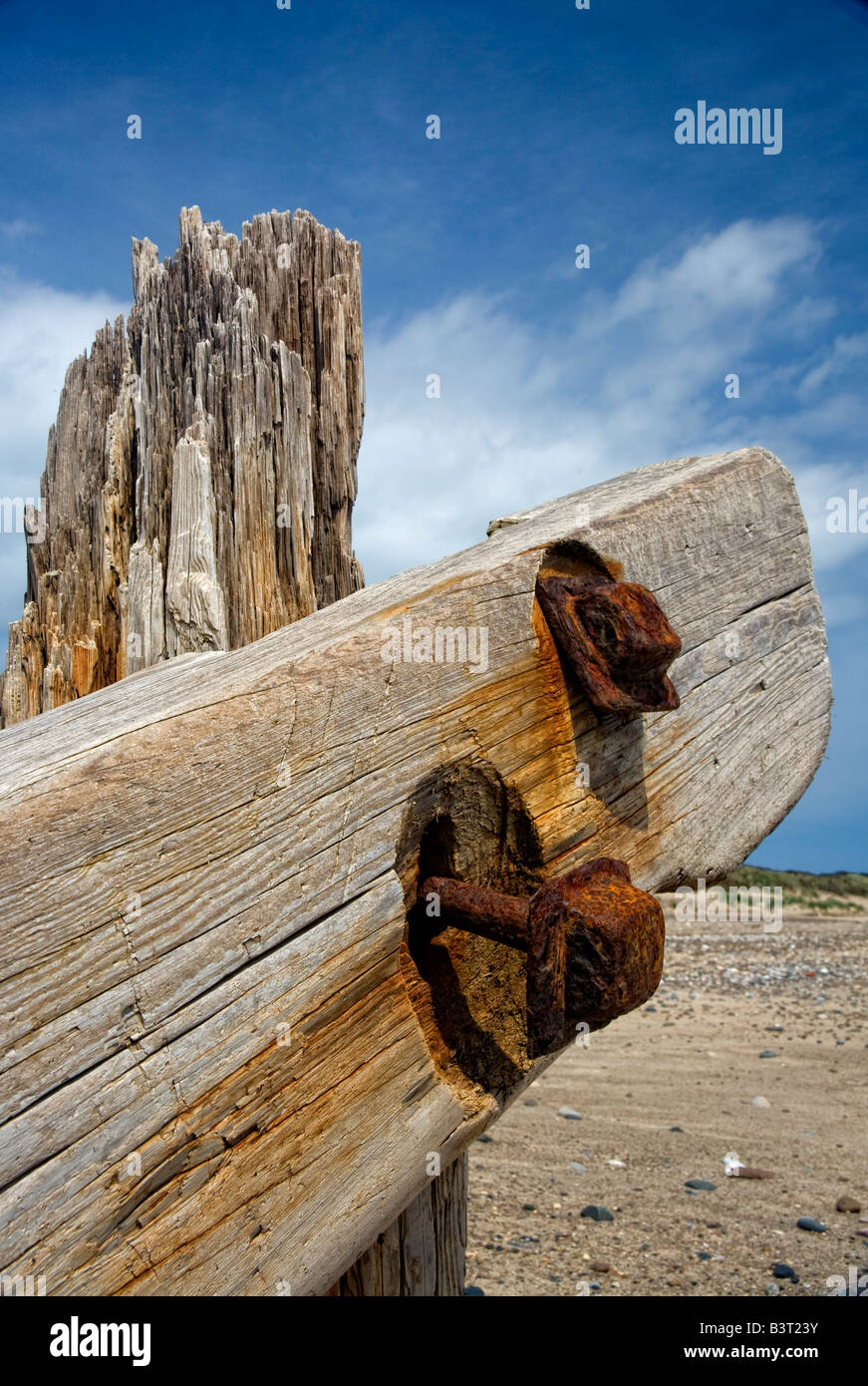Old post on beach Stock Photo - Alamy
