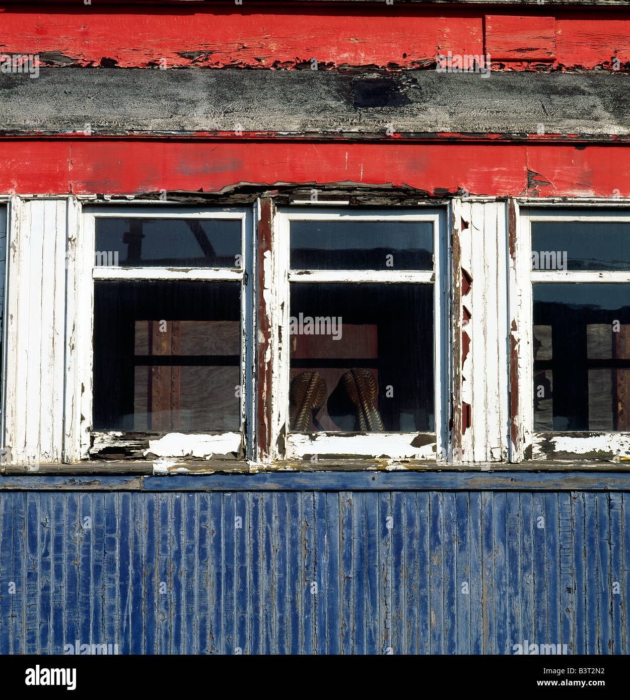 DETAIL OF PEELING RED WHITE & BLUE PAINT ON AN OLD RAIL CAR AT ...