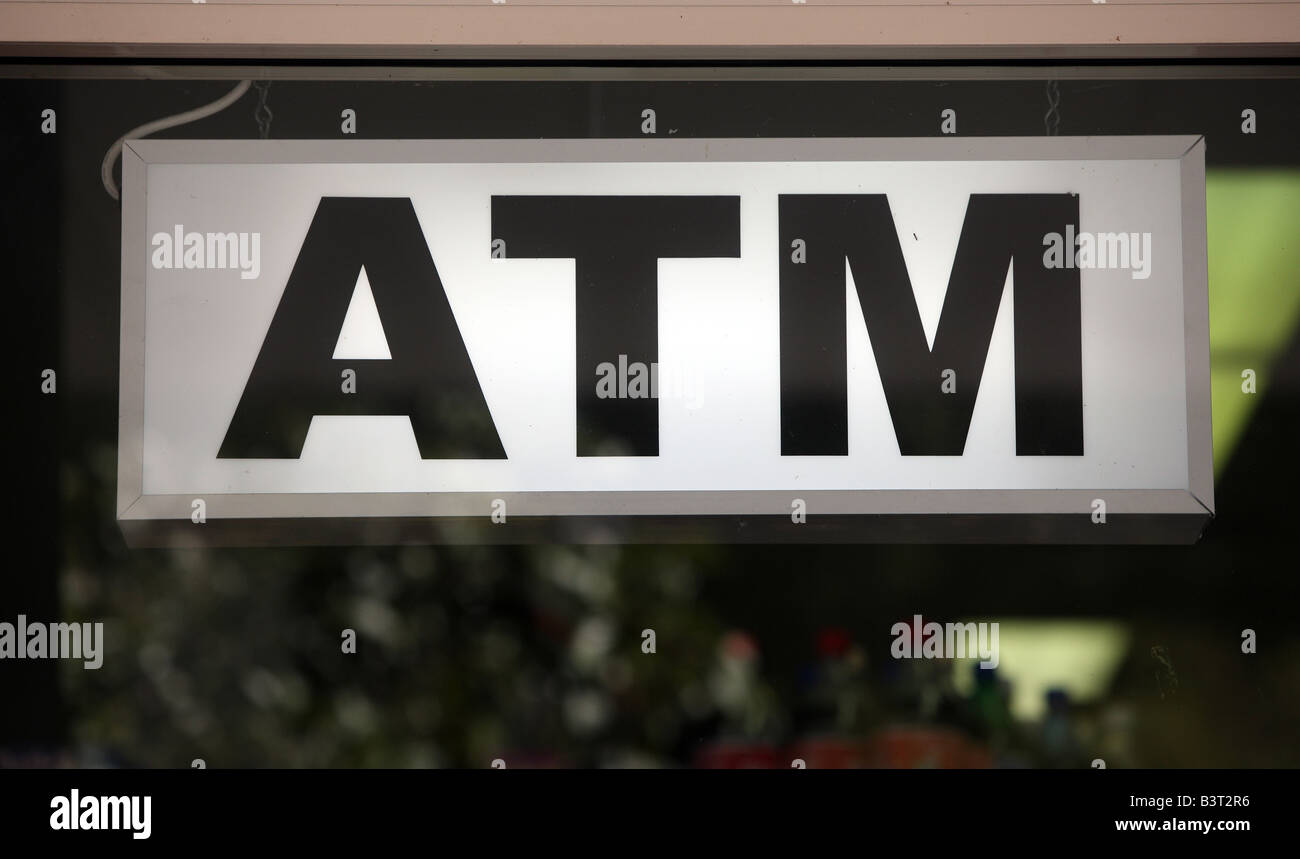 Illuminated sign for ATM Stock Photo - Alamy