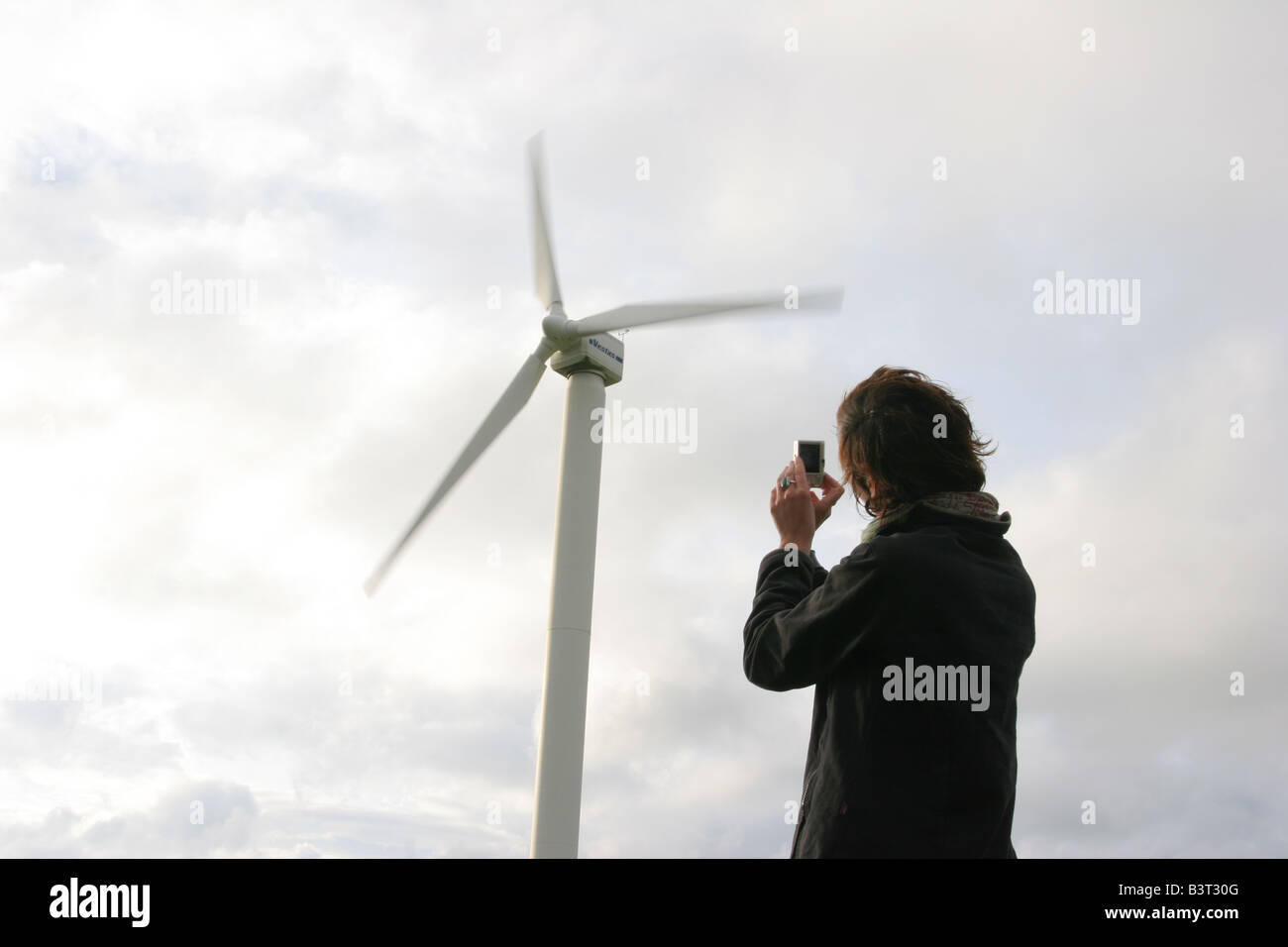 Person taking photograph of wind turbine Stock Photo - Alamy