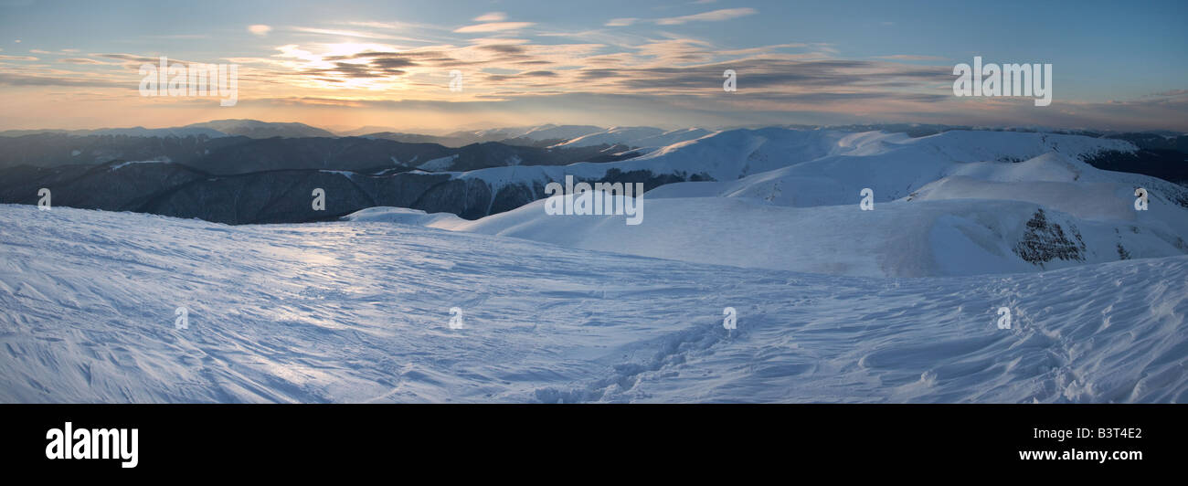 Beautiful mountain sunset landscape with sun way on ice-coated ...