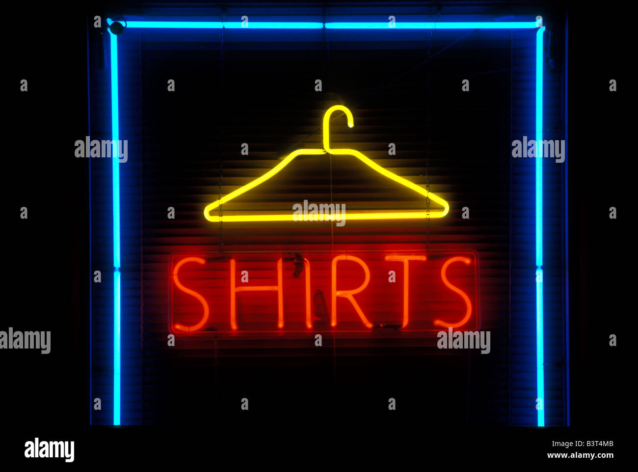 neon dry cleaner shirt hanger sign Stock Photo - Alamy