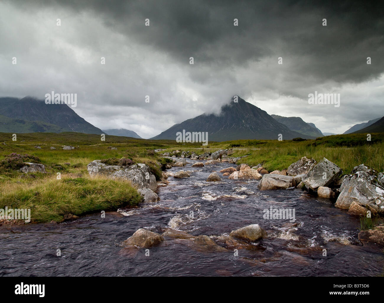 A stream running over Rannoch Moor in the highlands of Scotland with ...