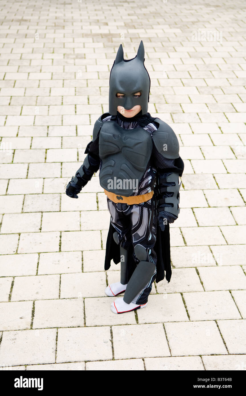 Portraits of young four year old boy dressed up in Batman suit posing ...