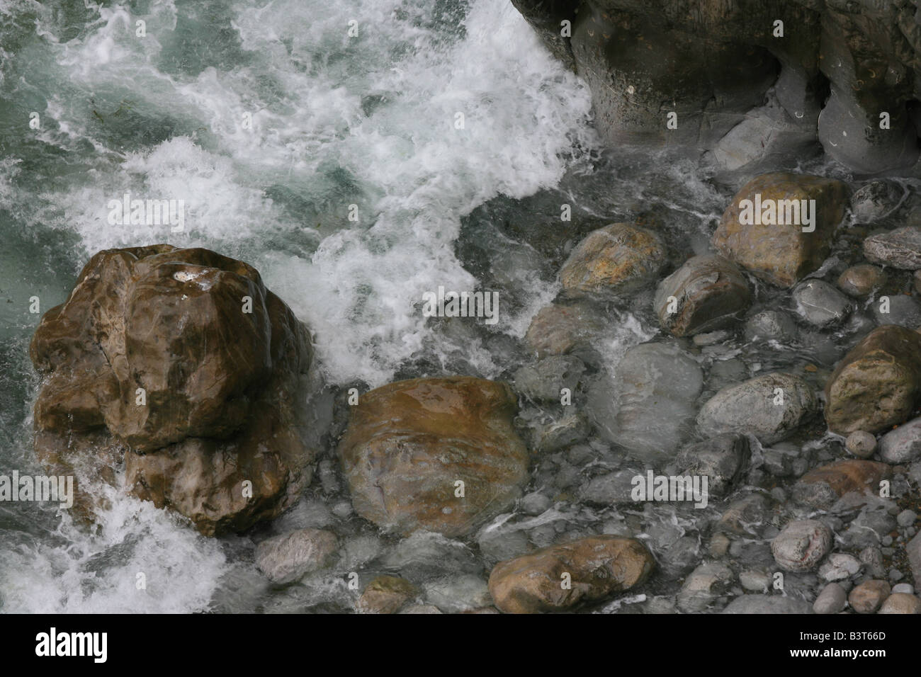Waves over rocks on the Welsh coast Stock Photo - Alamy