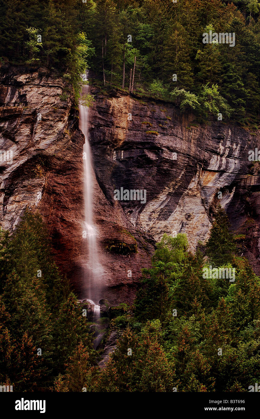 A waterfall scenery in the Alps, near Grindelwald, Switzerland Stock ...