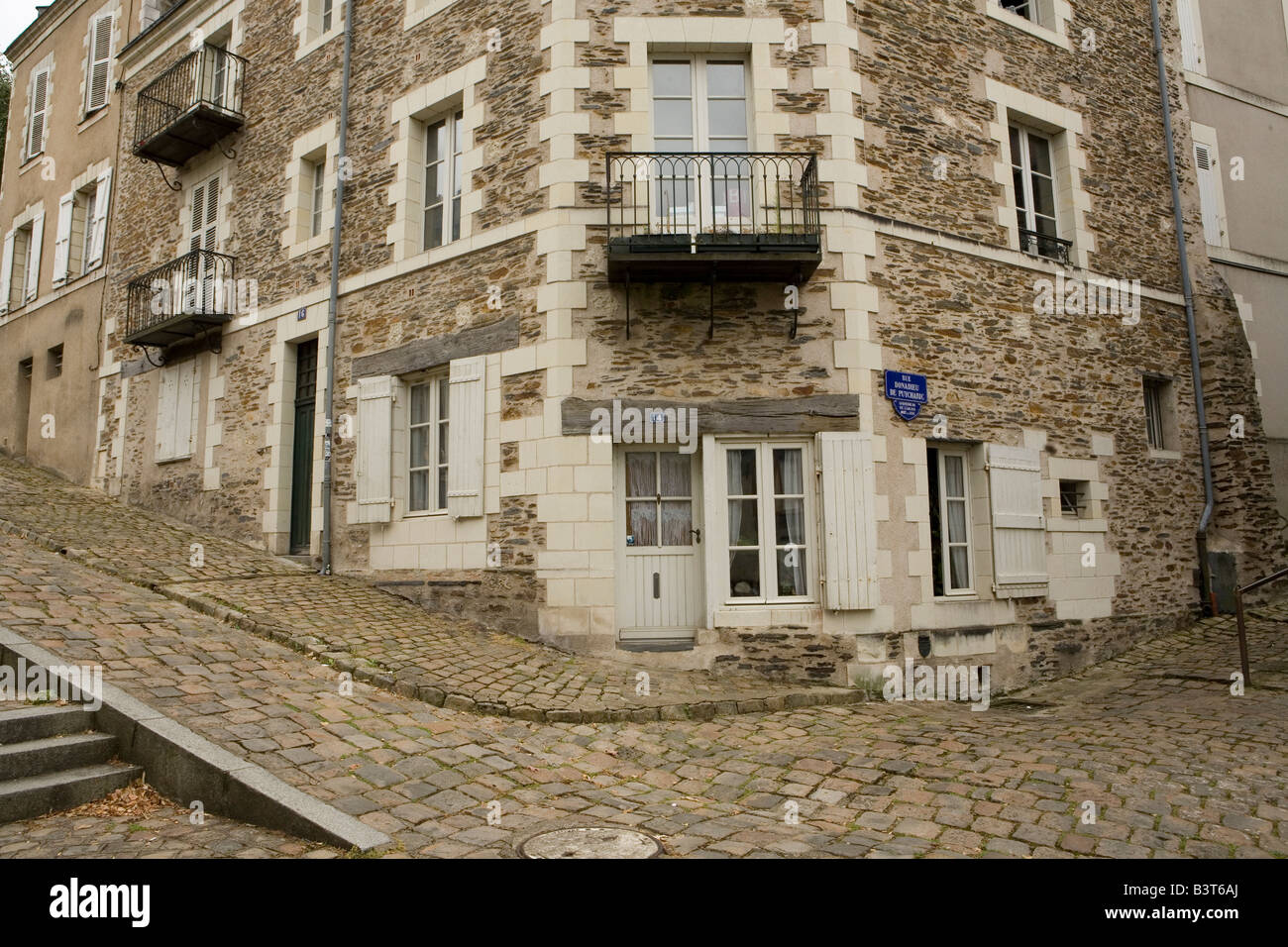 old stone buildt buildings facing the street in Angers, France Stock ...