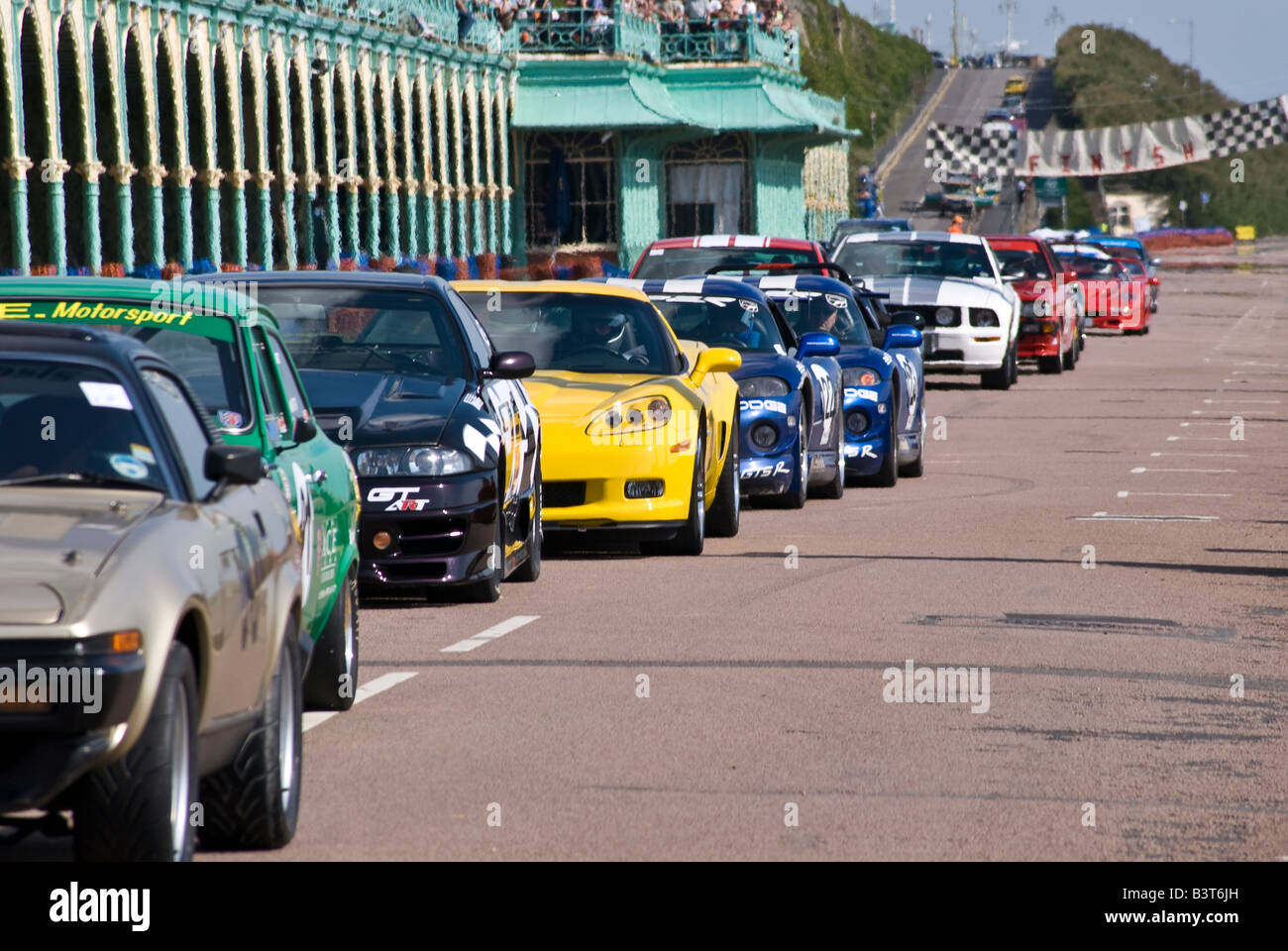 A parade of racing cars returning from the finish line Stock Photo - Alamy