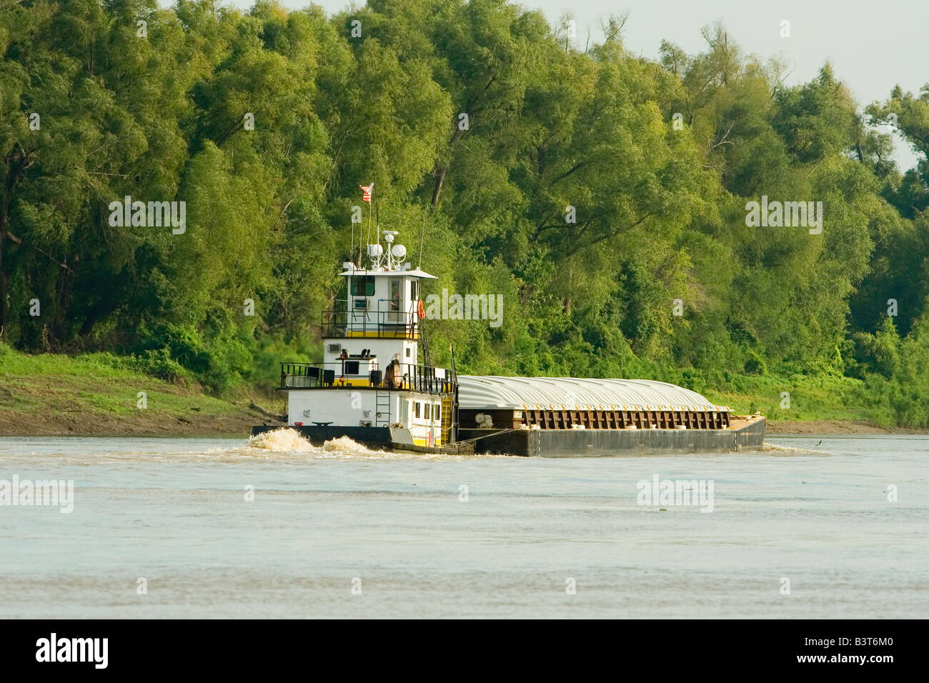 Small towboat and barge Stock Photo - Alamy