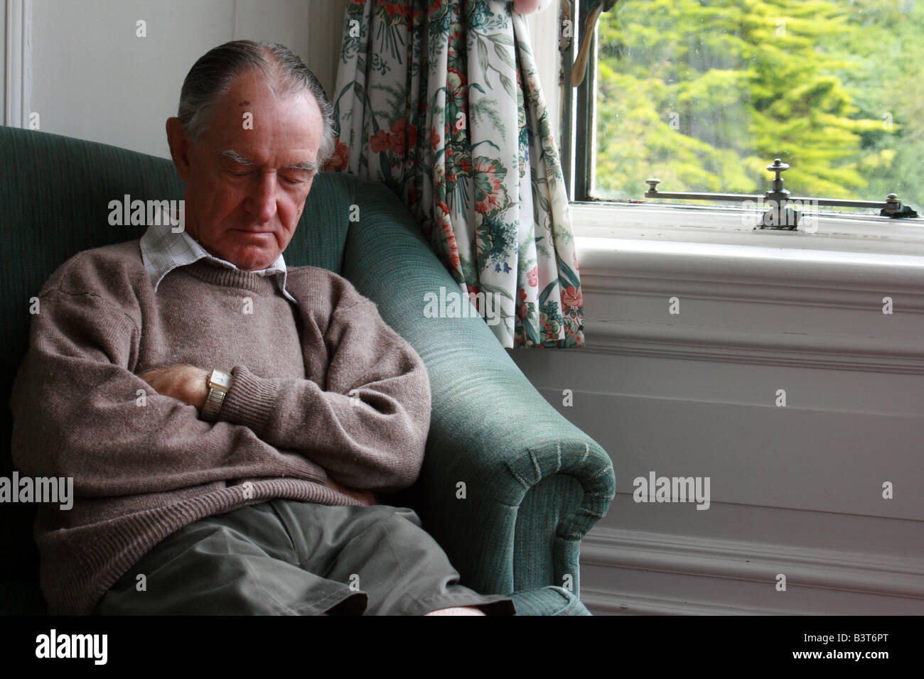 Old man sleeping on chair hi-res stock photography and images - Alamy
