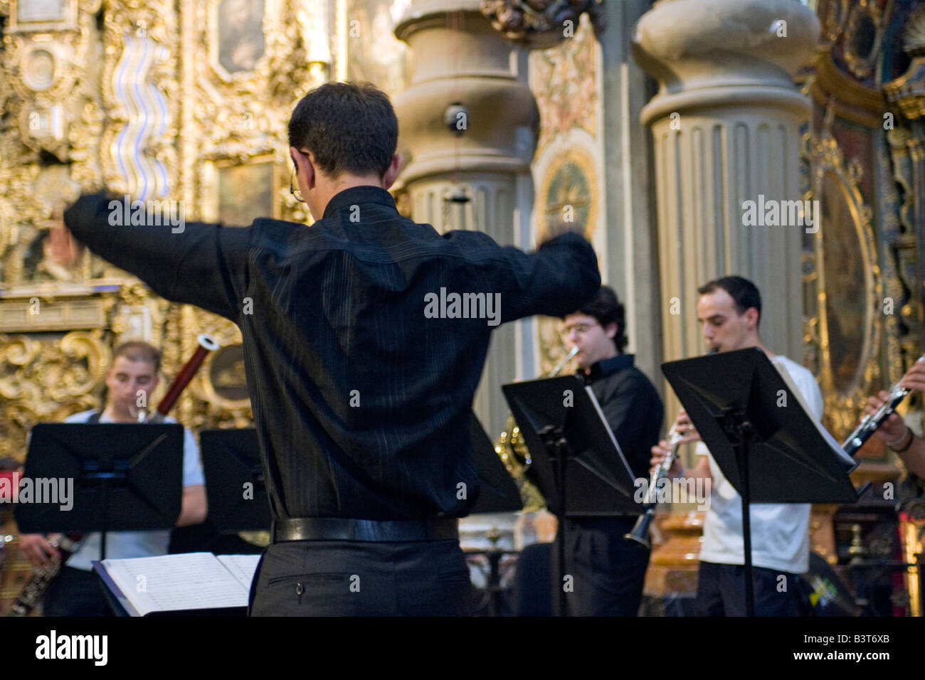 Classical music conductor during a concert in San Luis de los Franceses ...