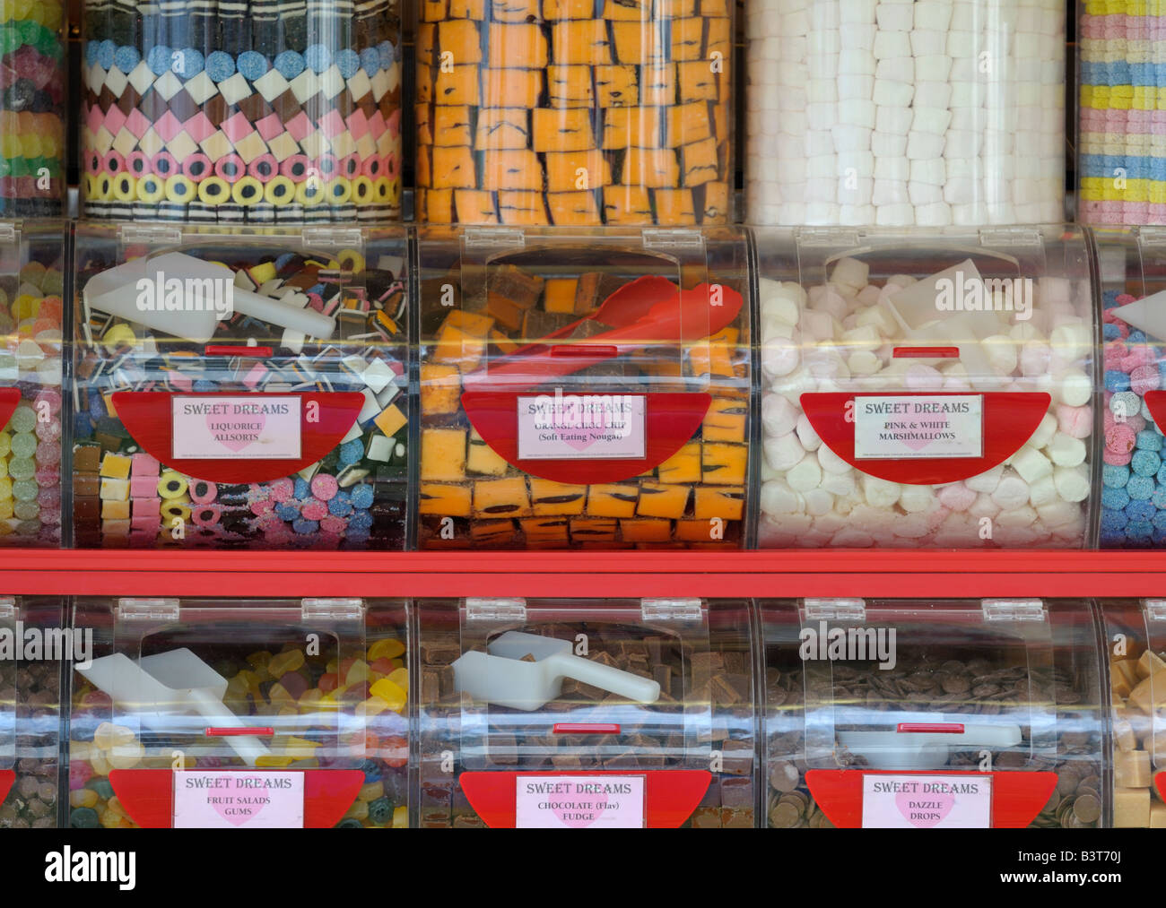Sweet containers on a market stall Stock Photo - Alamy