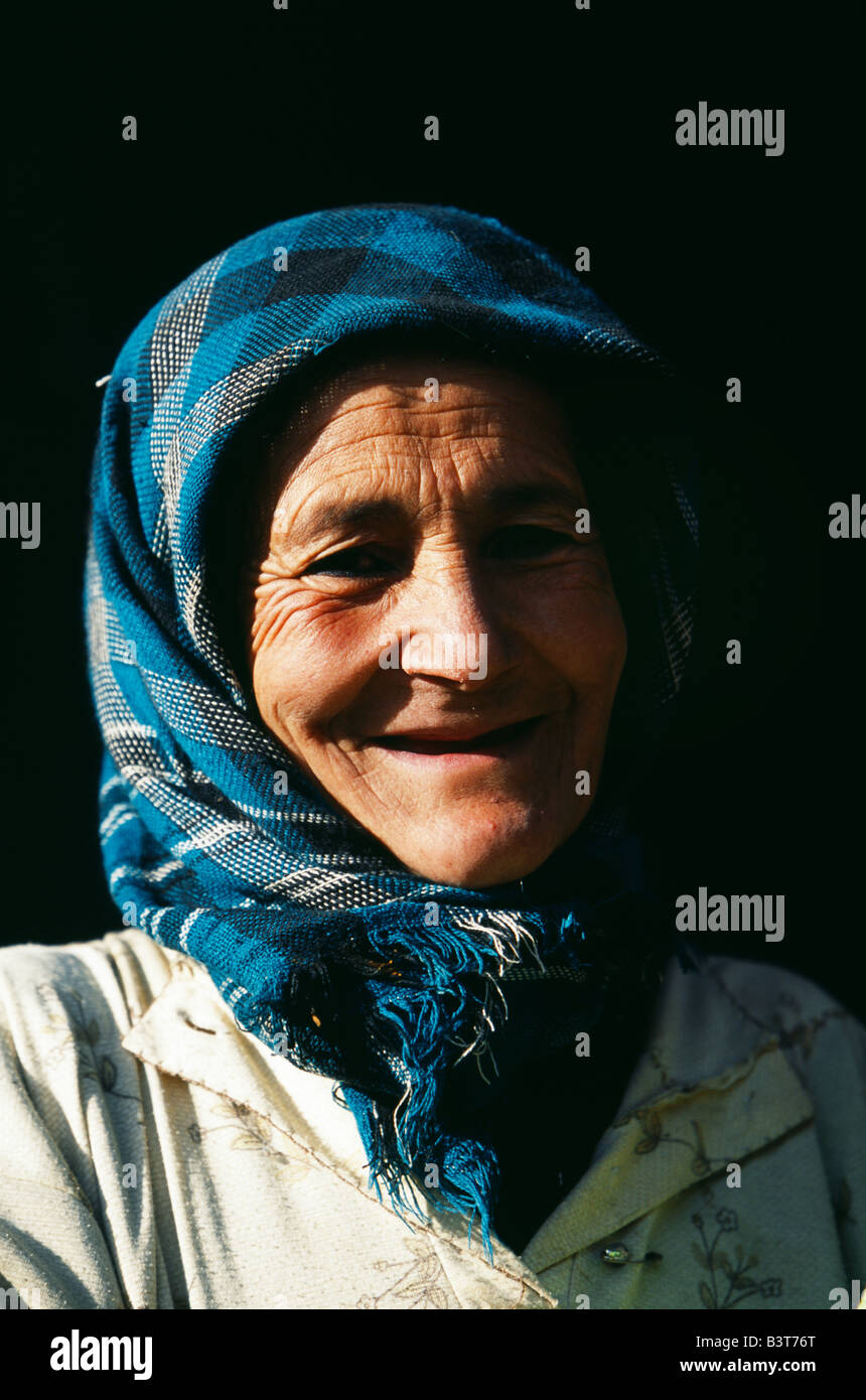 Old lady in scarf in the village of Roglglt, High Atlas Mountains ...