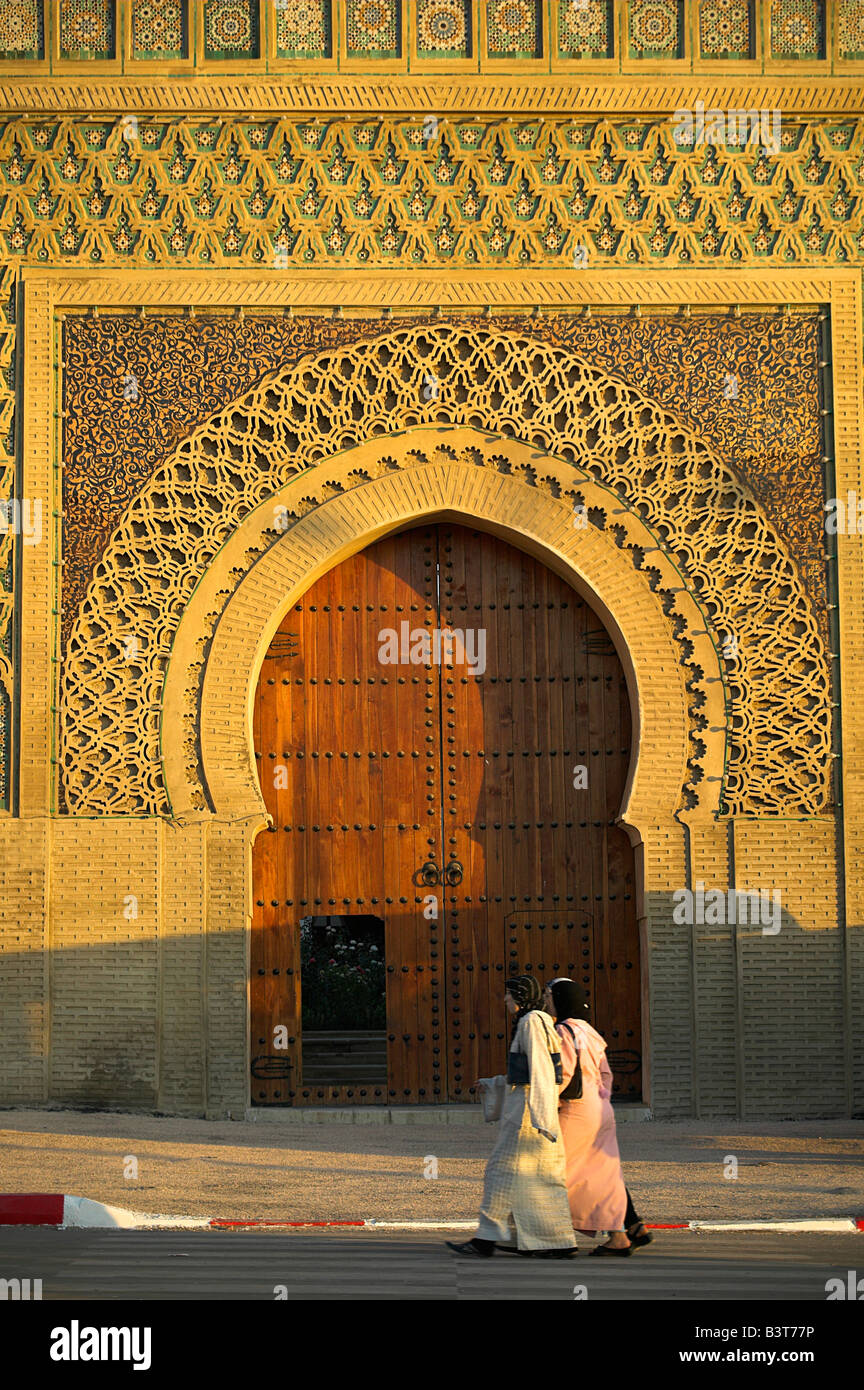 Two muslim women walk past the Bab el Mansour in Meknes, Morocco ...
