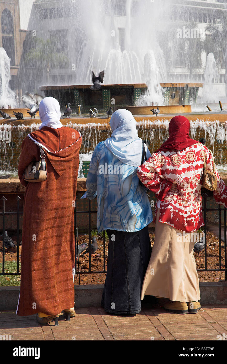 Morocco, Maghreb, Casablanca. Veiled Muslim women enjoy the fountain in ...