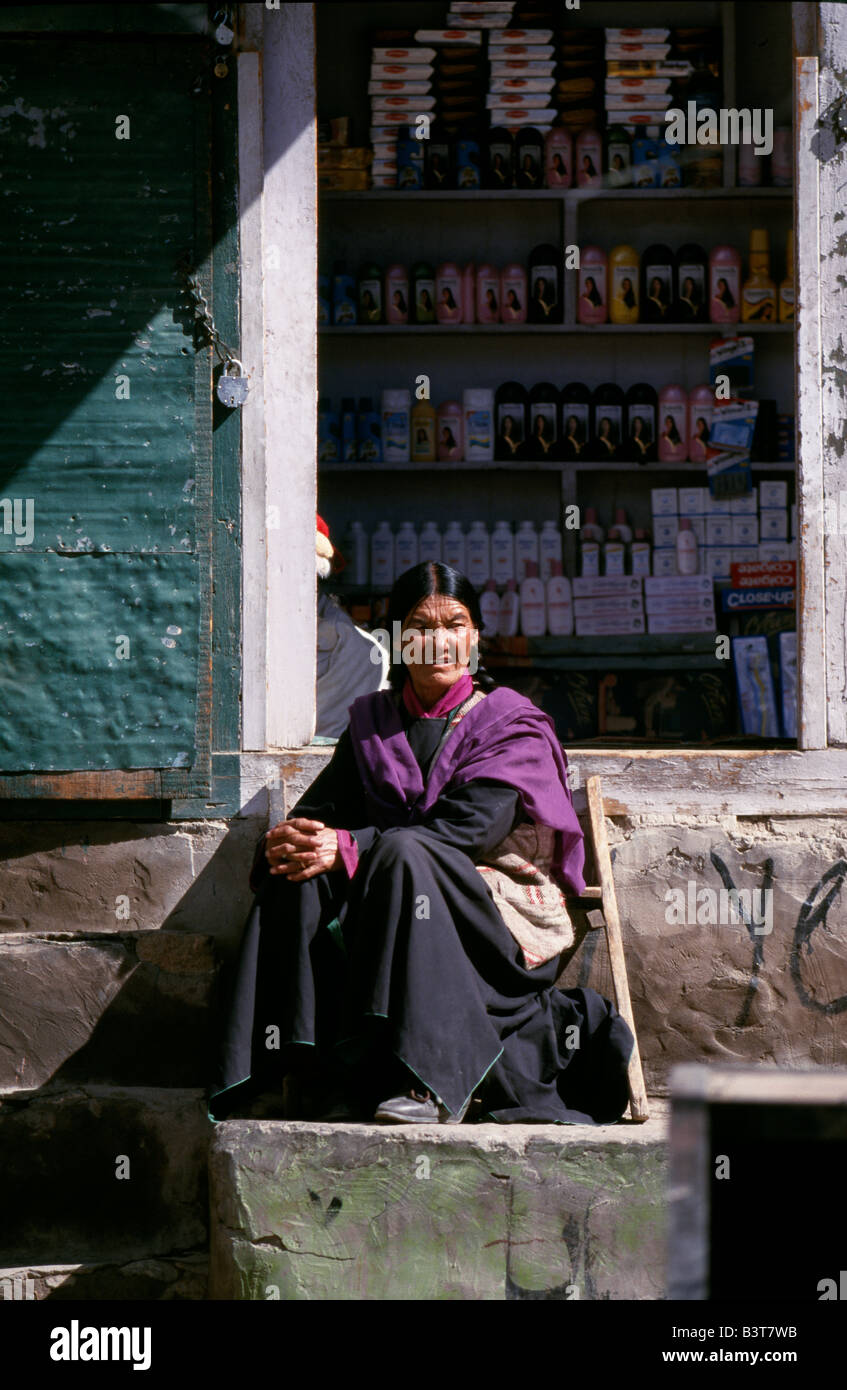 India, Ladakh, Leh. Woman shopkeeper resting outside of shop Stock ...