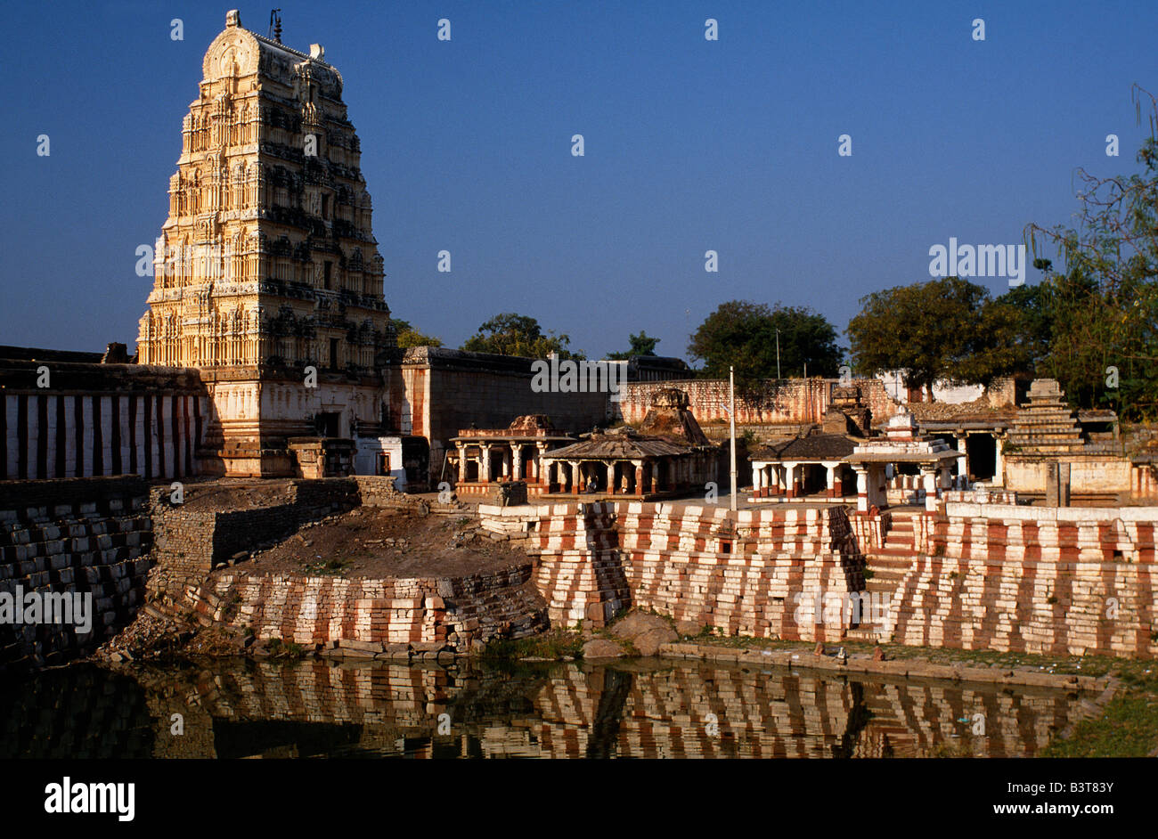 India, Karnataka, Hampi. A soaring gateway and the painted steps of a ...