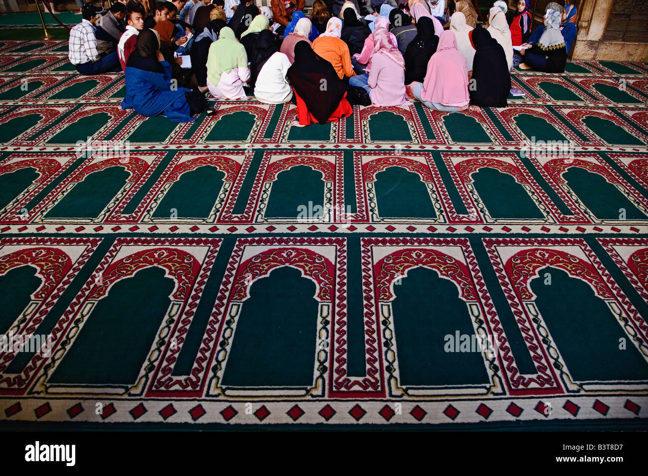 Islamic group on prayer rugs at Islamic mosque, Cairo, Egypt Stock ...