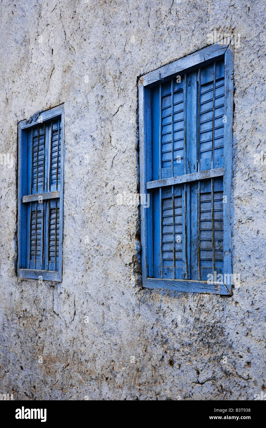Pair of blue windows in alley, rural village outside Luxor, Egypt Stock ...