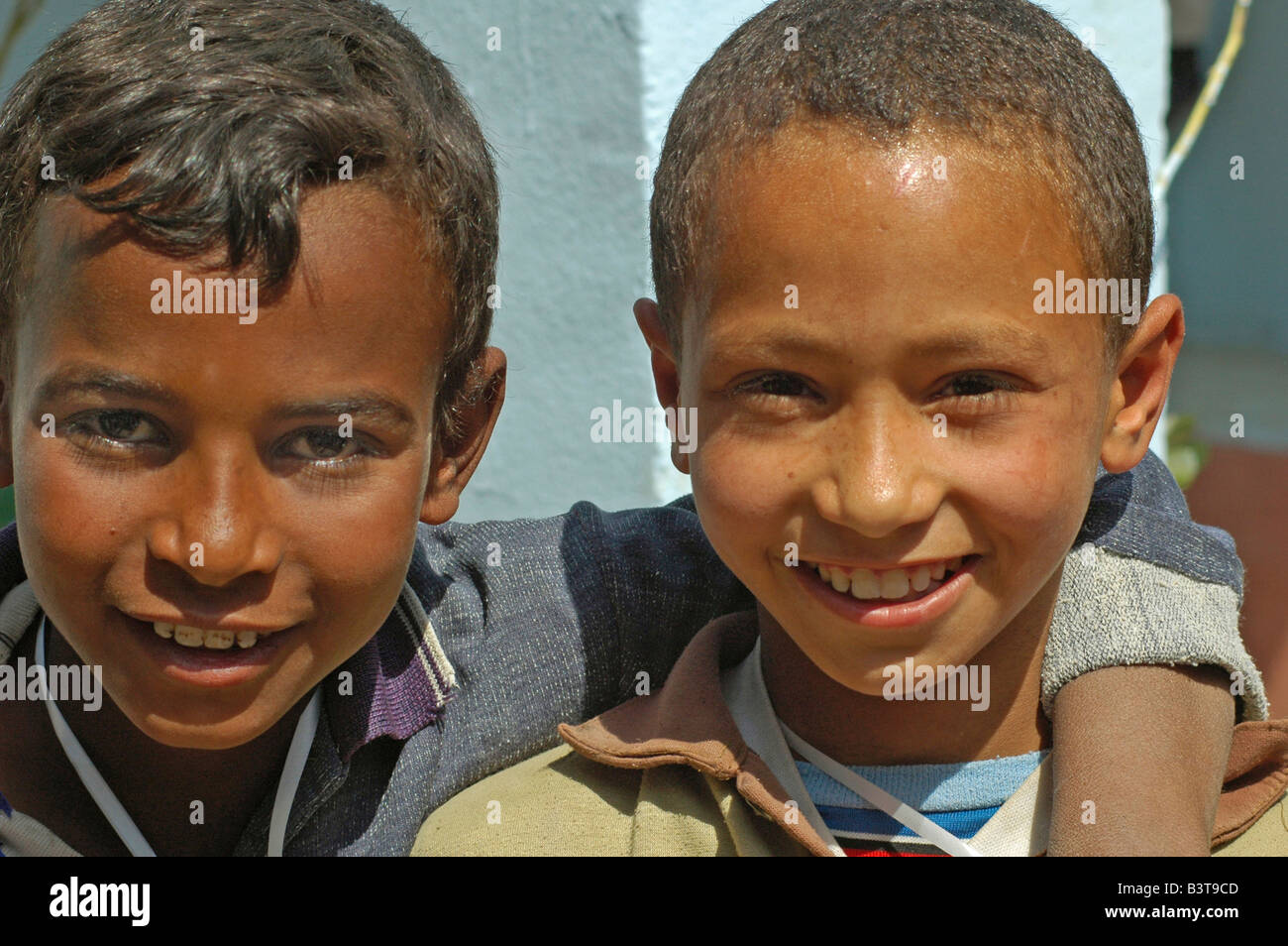 Smiling arabic boys embracing each other Stock Photo - Alamy