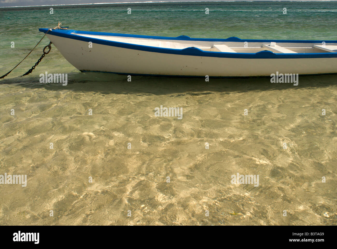 Mauritius. Fishing boat in calm lagoon Stock Photo - Alamy