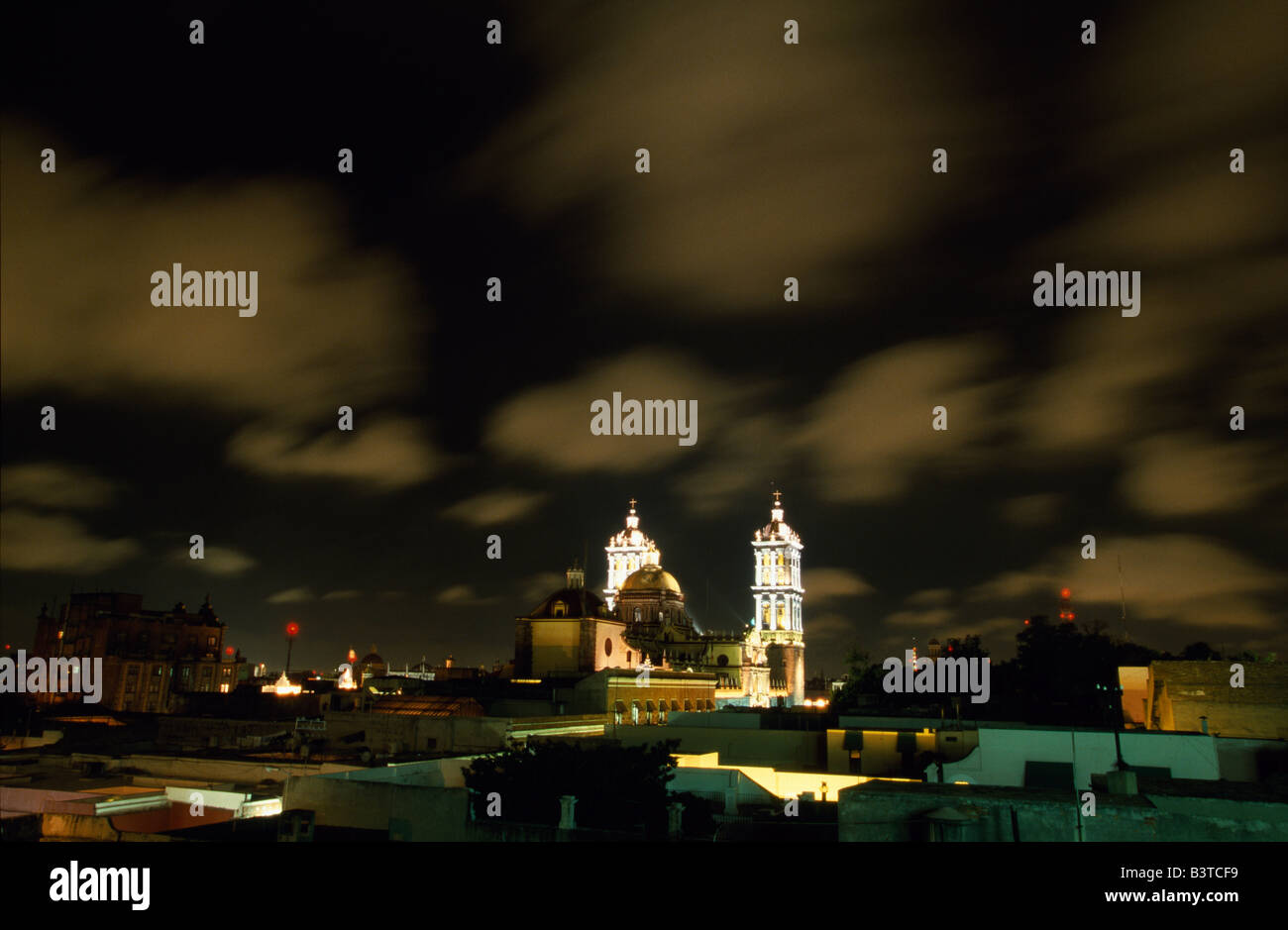Mexico, Puebla State, Puebla. Puebla Cathedral's illuminated towers ...