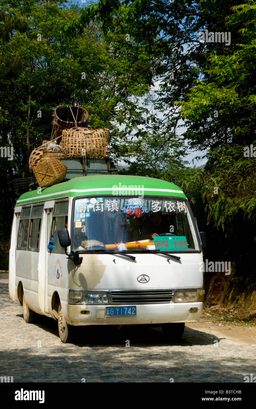 Asia, China, Yunnan Province, Yuanyang. Small bus provides ...