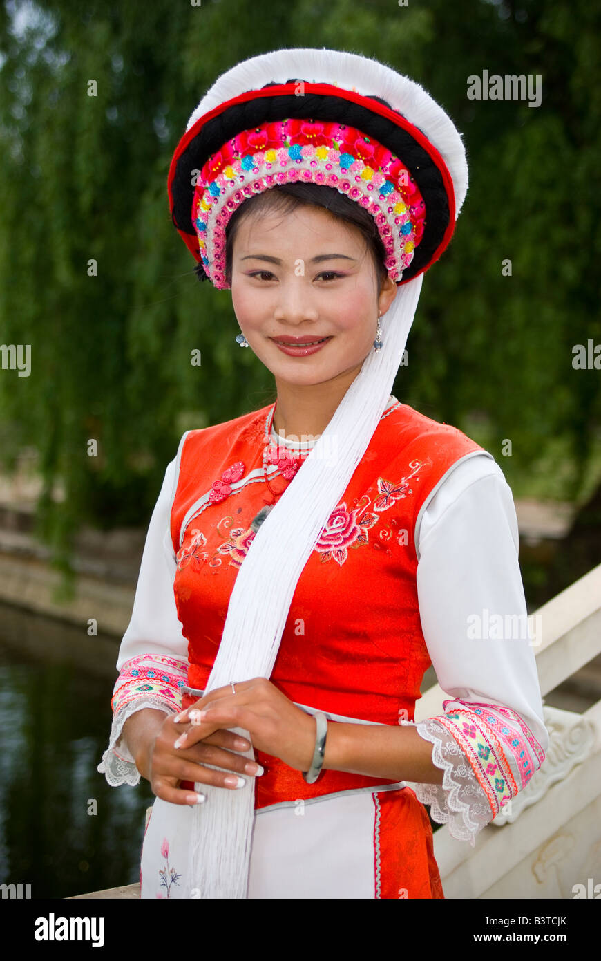 Asia, China, Yunnan Province. Young Bai minority woman in traditional ...