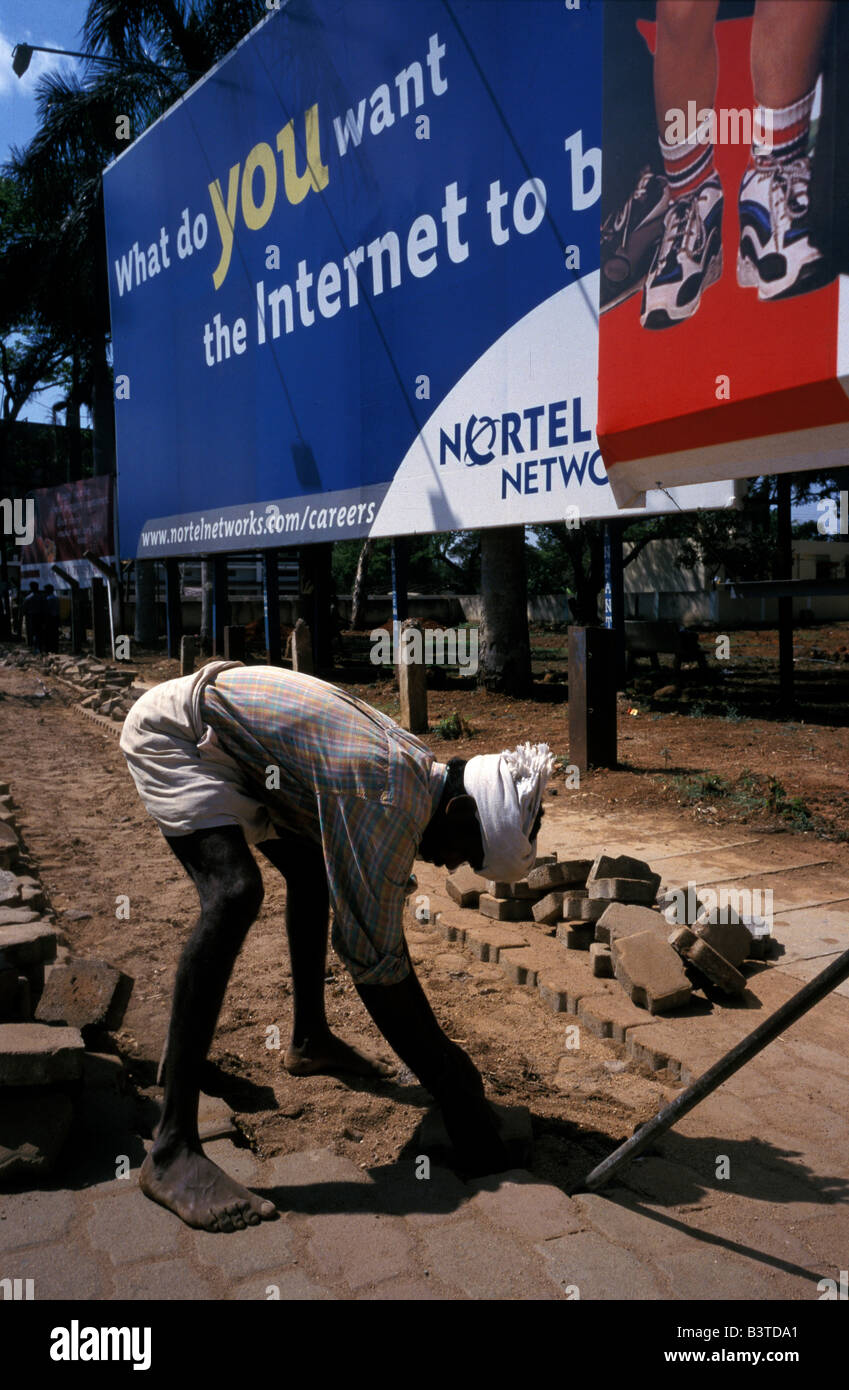 Asia, India, Bangalore. Western billboard and poor worker Stock Photo ...