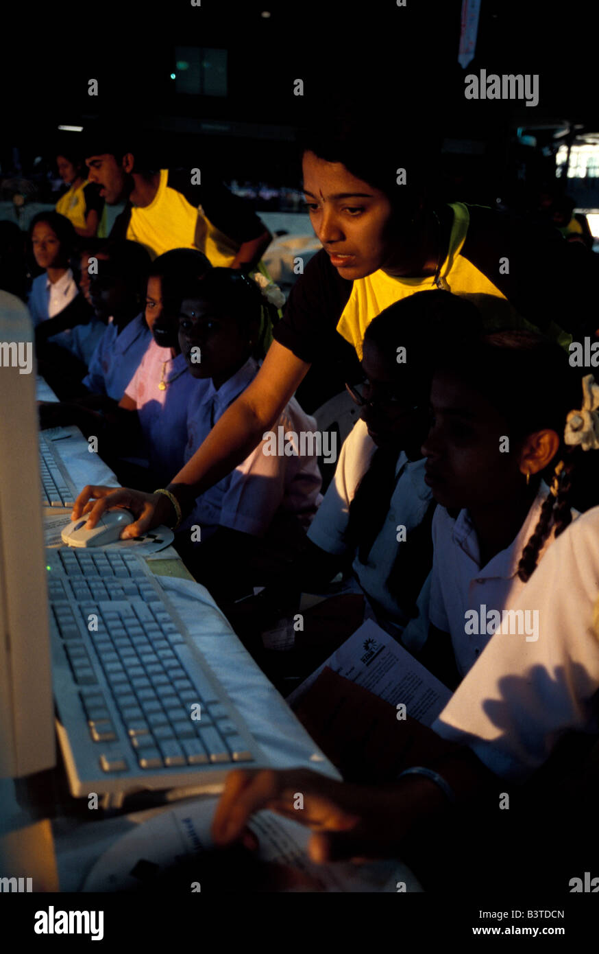 Asia, India, Bangalore. Indian girl shows computer usage Stock Photo ...