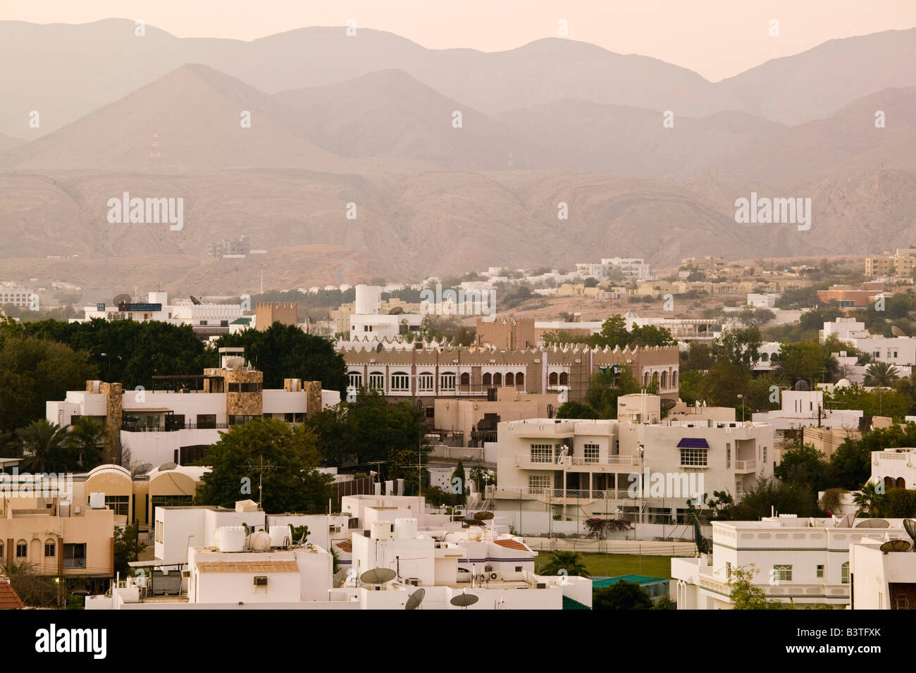 Oman, Muscat, Qurm. Dawn view of Qurm Area Buildings Stock Photo - Alamy