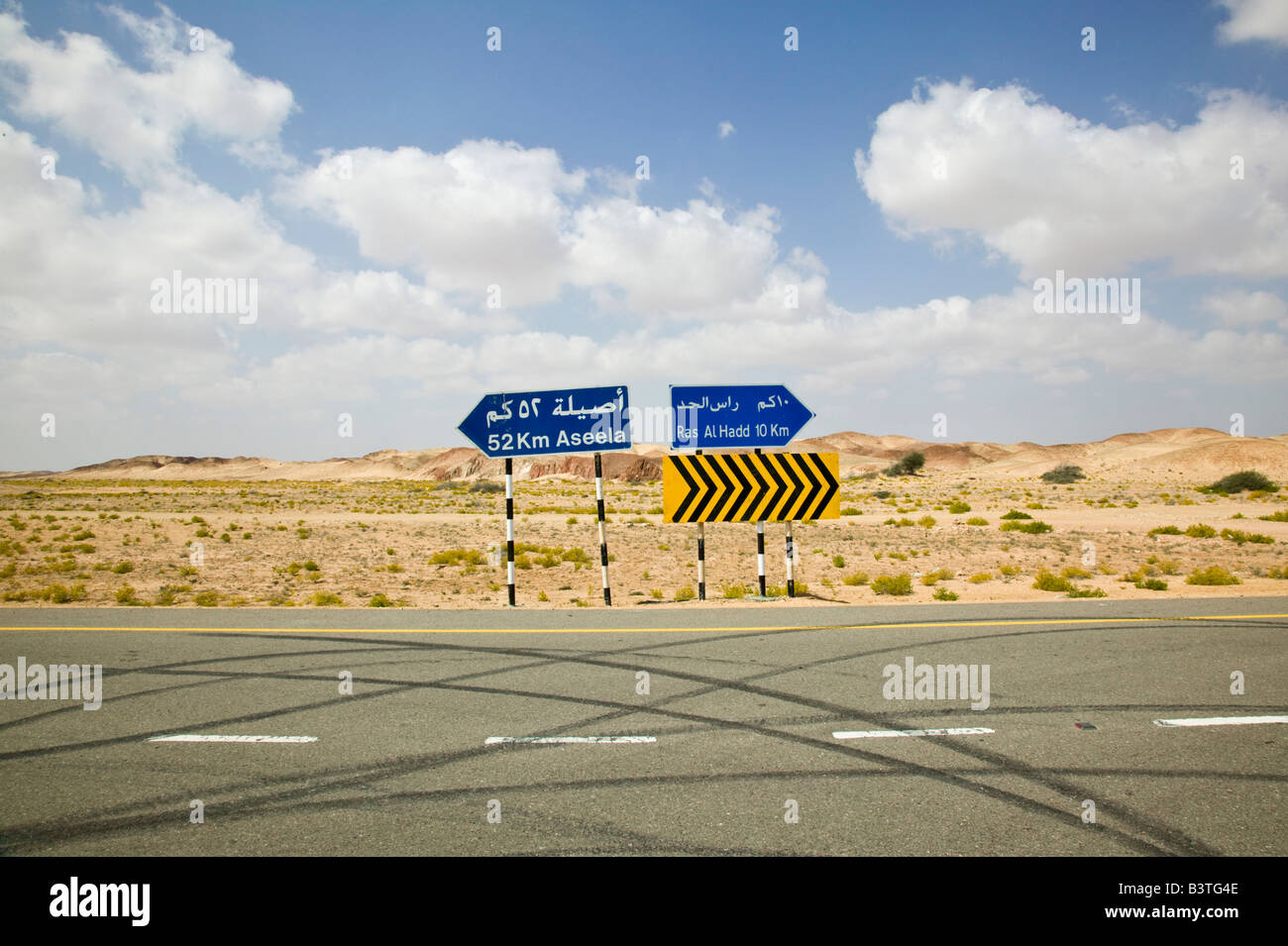 Oman, Sharqiya Region, Ad Daffah. Road signs along Eastern Highway ...