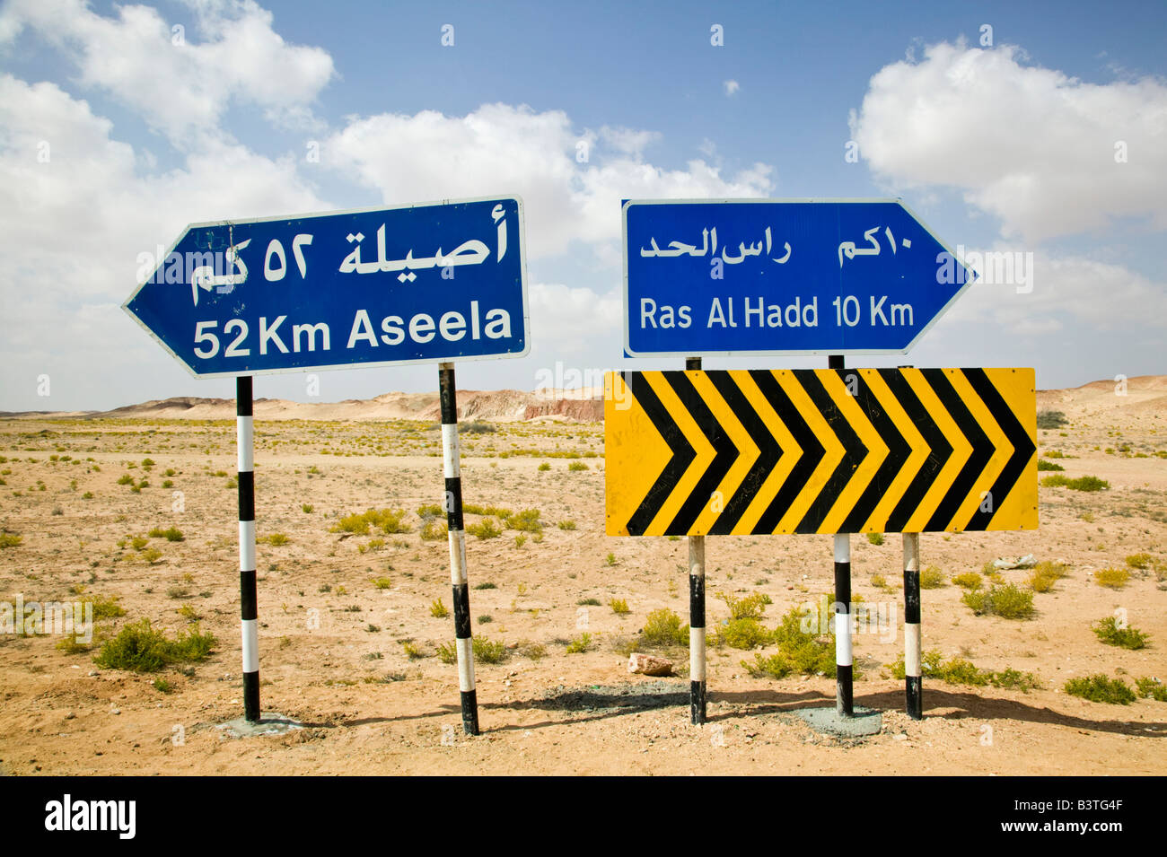 Oman, Sharqiya Region, Ad Daffah. Road signs along Eastern Highway ...