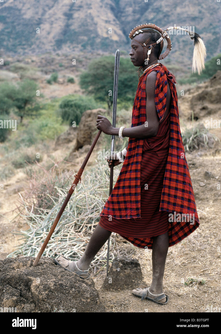 Tanzania, Northern Tanzania, Engaruka. A Maasai warrior with his hair ...