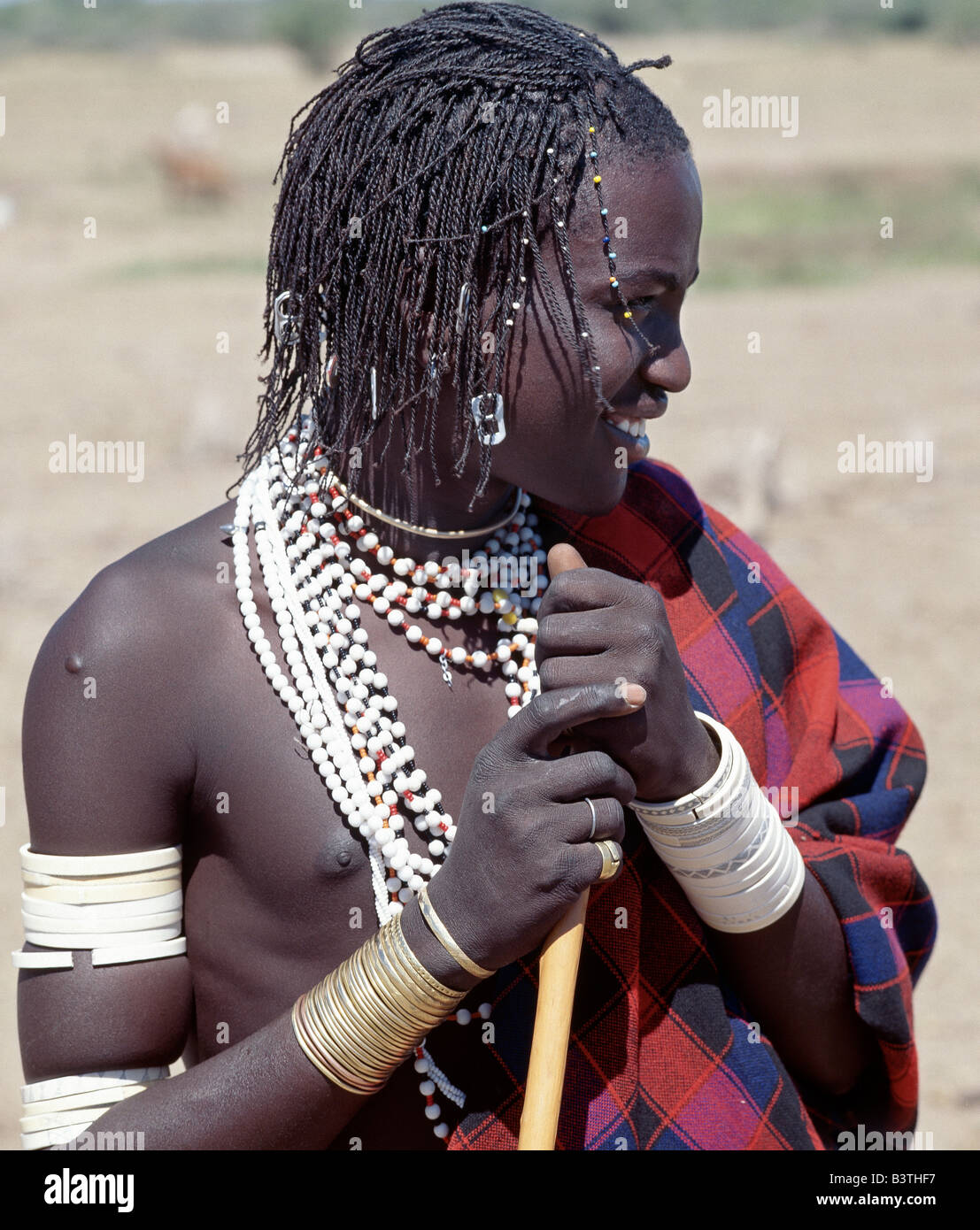 Tanzania, Arusha, Lake Eyasi. A Datoga young man in traditional attire ...