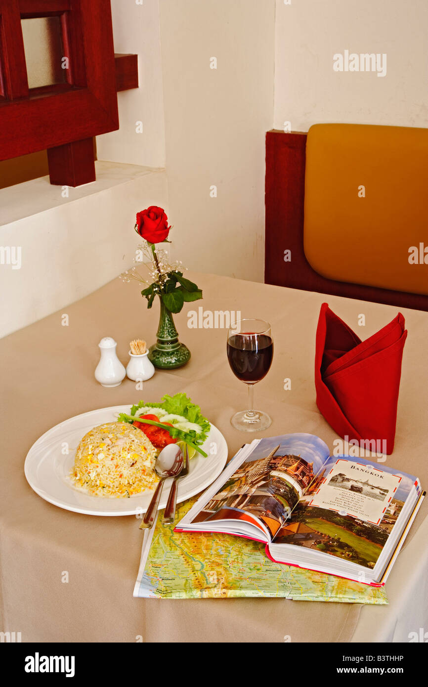 Travel guide, map, and food dish served in Thai restaurant, Bangkok ...