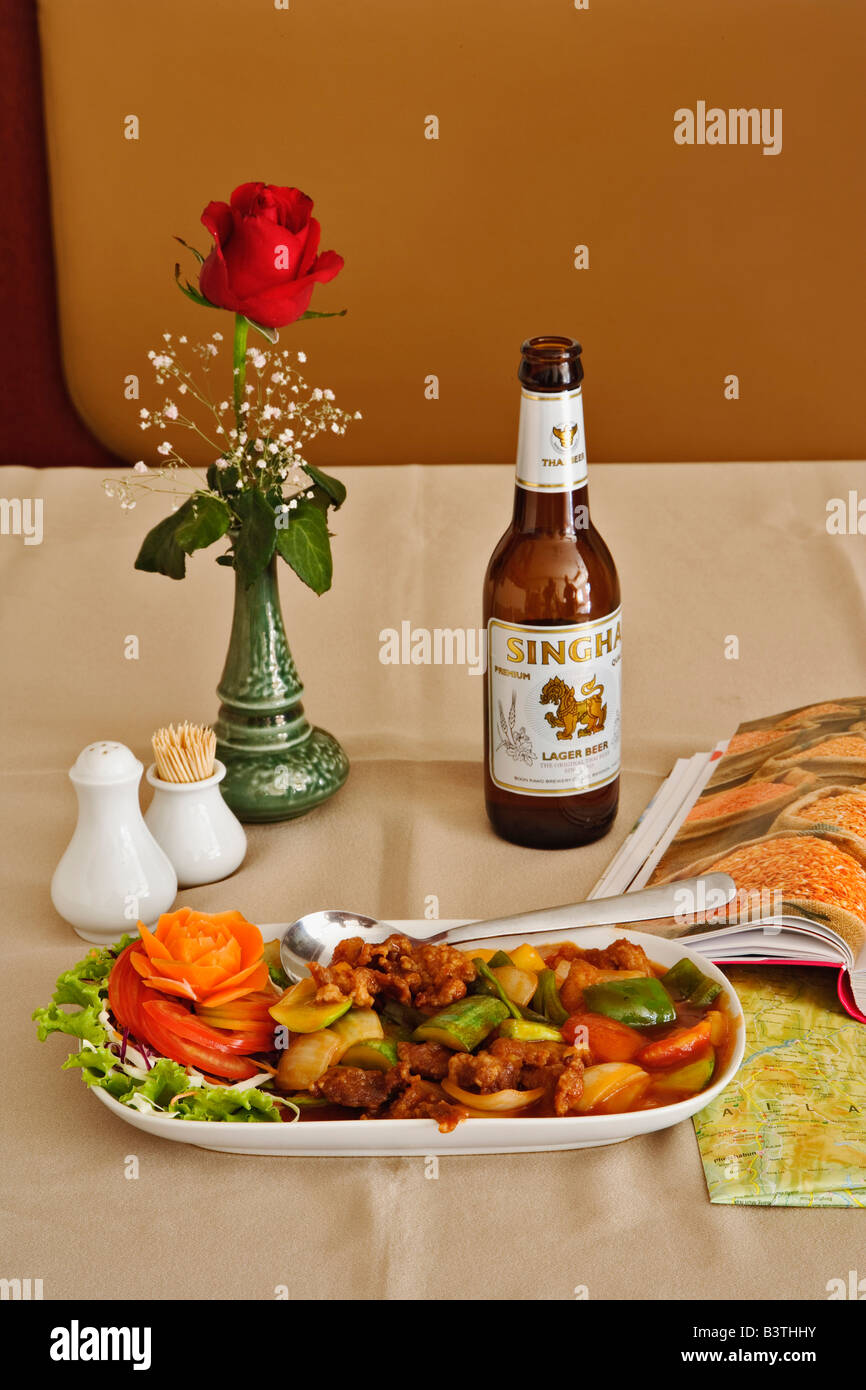 Travel guide, map and meal served in Thai restaurant, Bangkok, Thailand ...