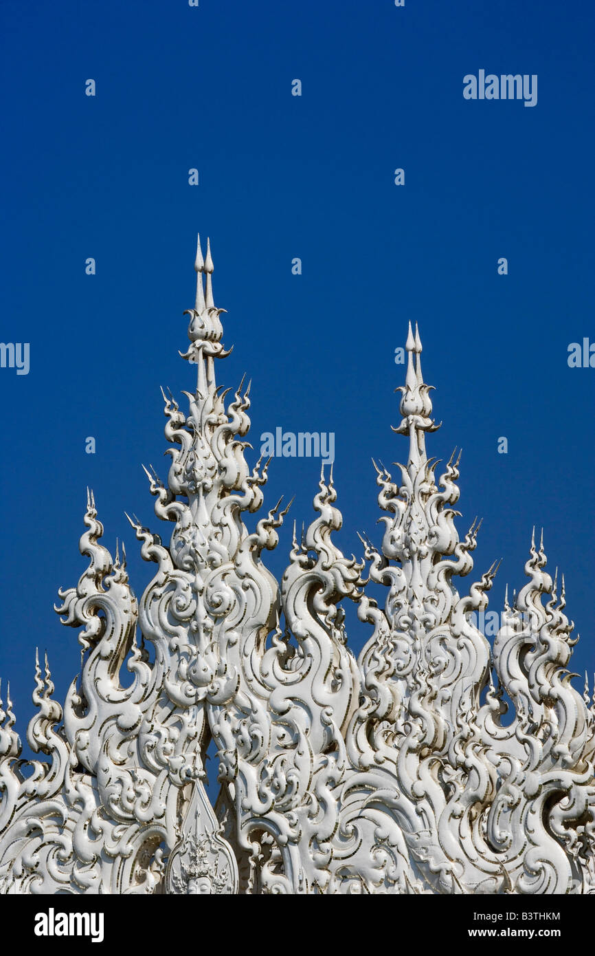 Rooftop architectural detail of dragon head on the new all white temple ...
