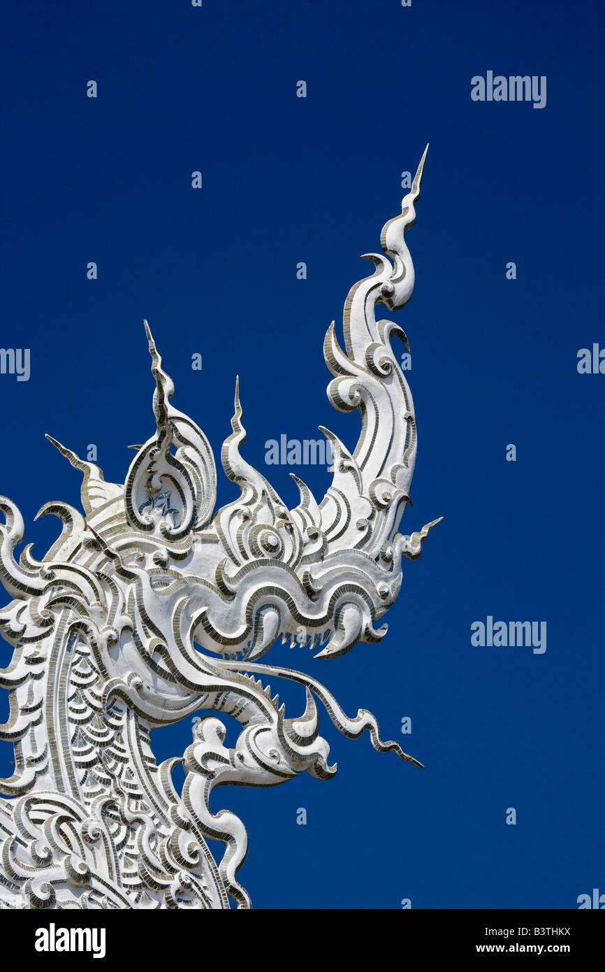 Rooftop architectural detail of dragon head on the new all white temple ...