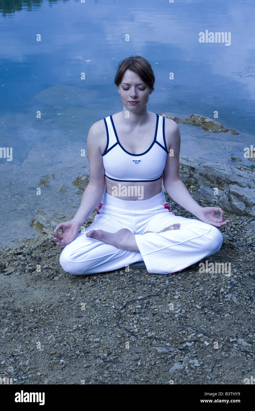 a woman practising yoga Stock Photo - Alamy
